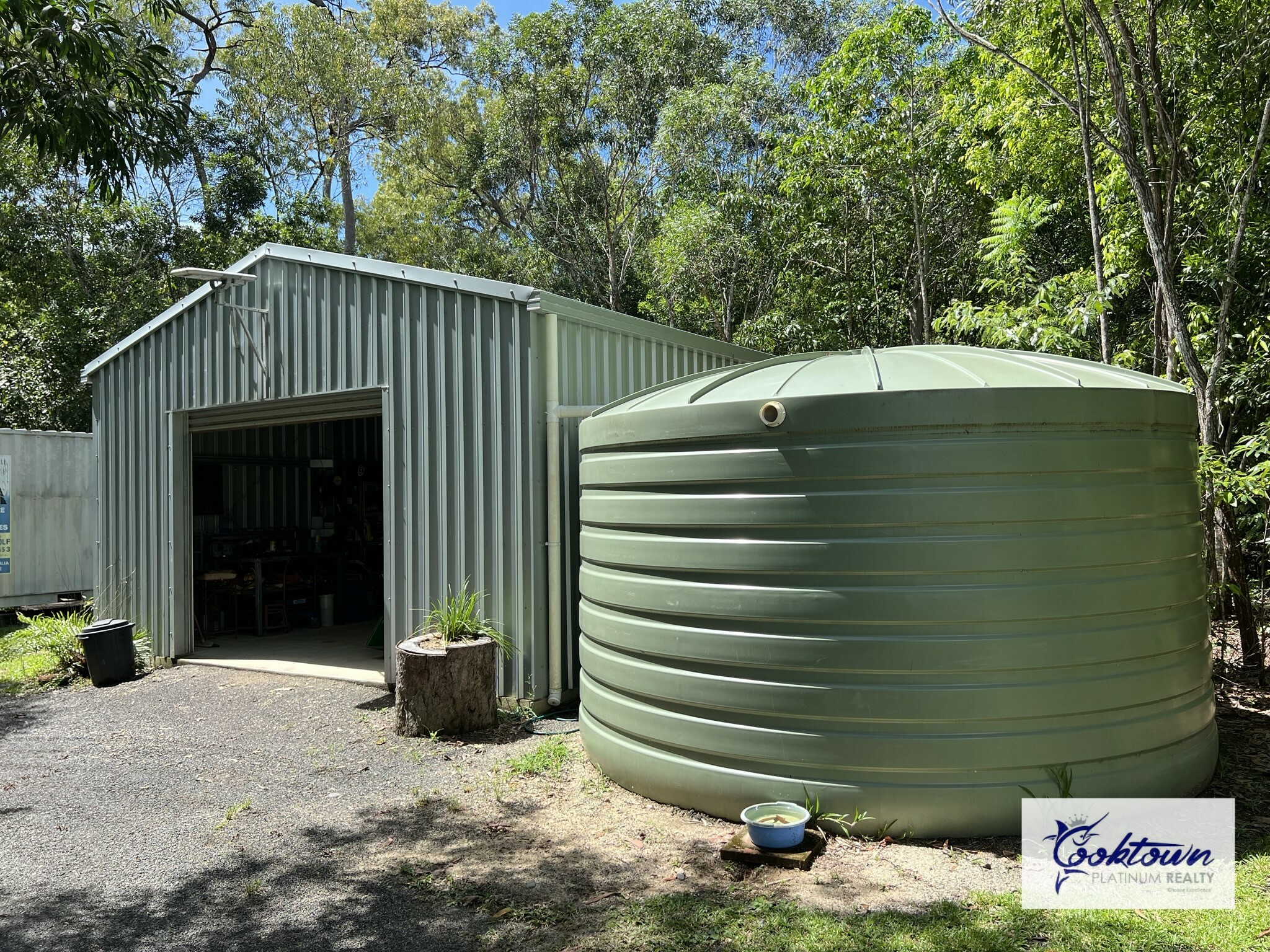 Fully fenced rainforest acreage with Creek and multiple dwellings, be ...