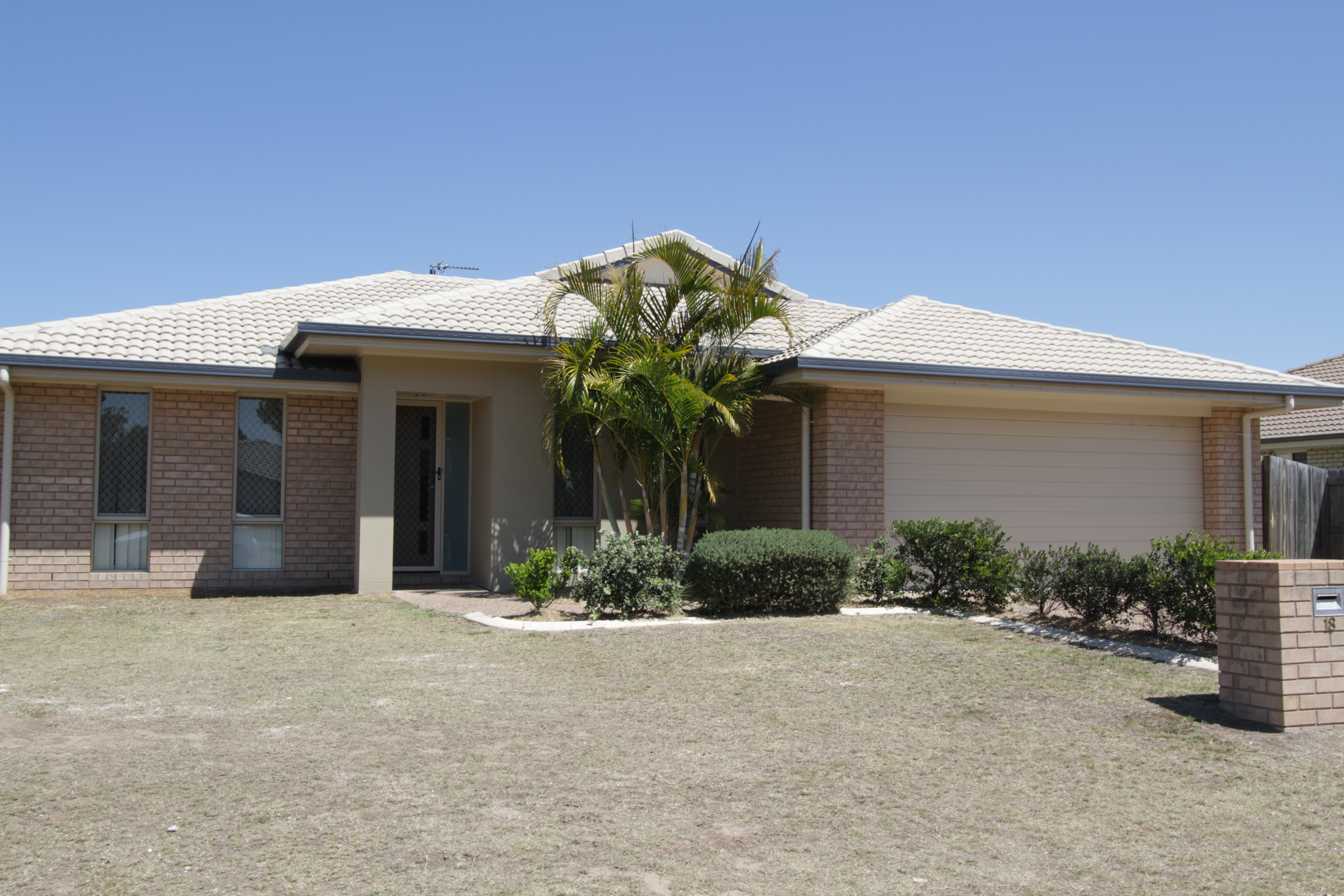 Ray Bachmann Real Estate - Roomy Low Set Brick Home